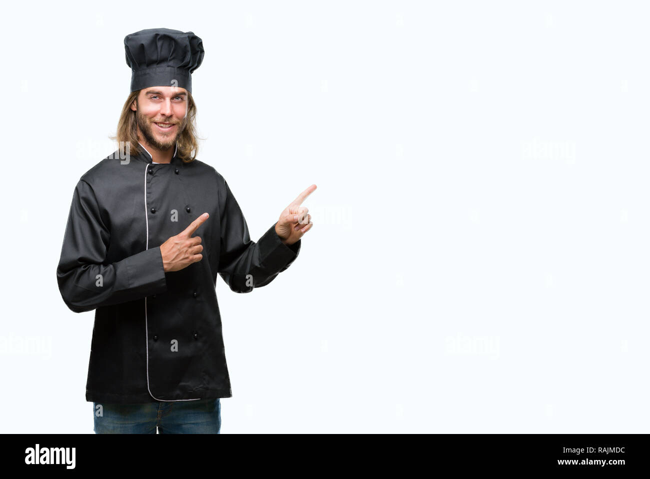 Young handsome cook man with long hair over isolated background smiling ...