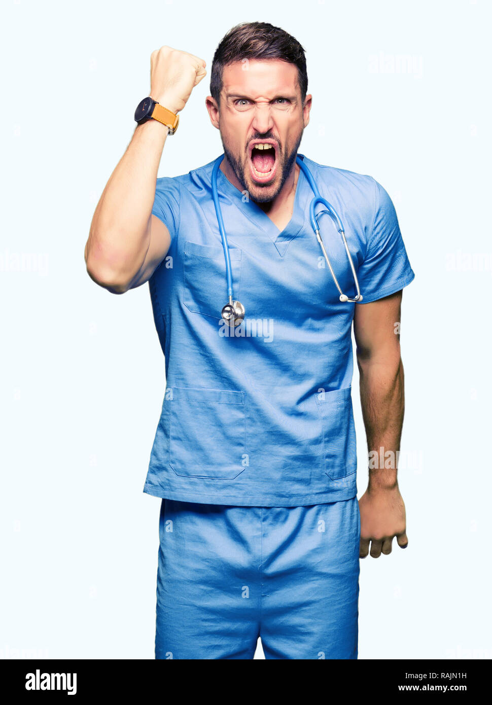 Handsome doctor man wearing medical uniform over isolated background ...