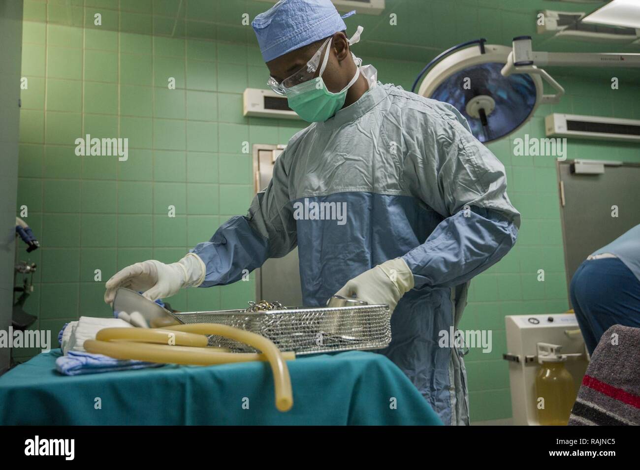 U.S. Army Sgt. Michael Harvey, an operating room specialist assigned to ...