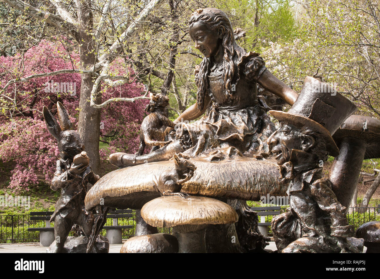 Alice in Wonderland Sculpture is framed by spring trees, Central Park ...
