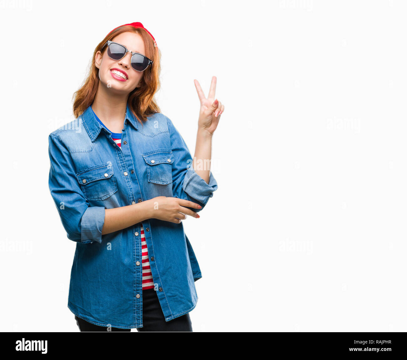 Young beautiful woman over isolated background wearing sunglasses ...