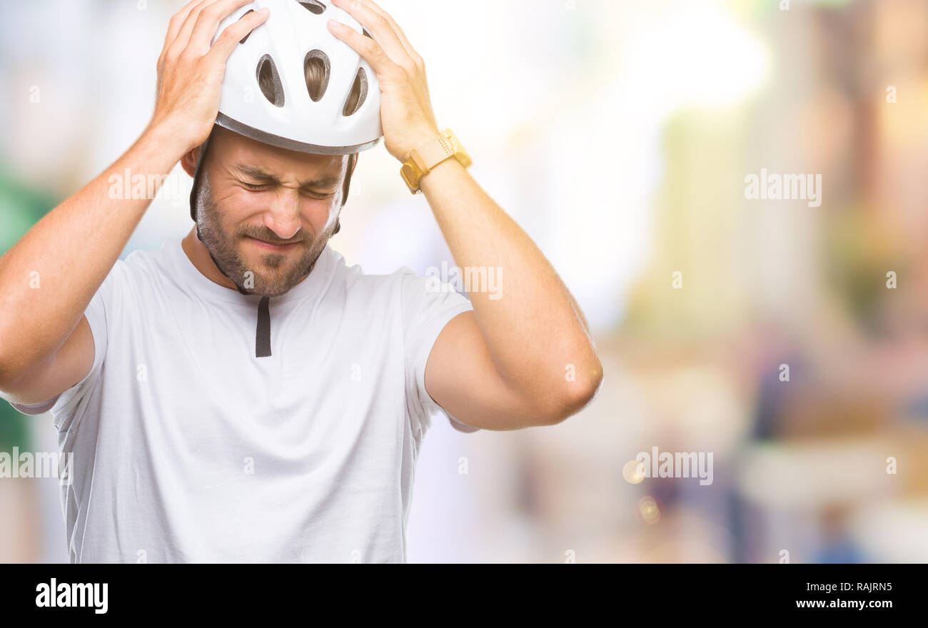 Young handsome man wearing cyclist safety helmet over isolated ...