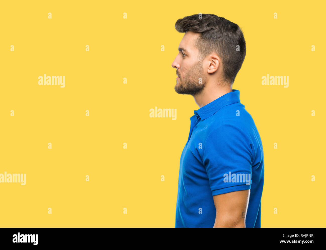 Young handsome man over isolated background looking to side, relax ...