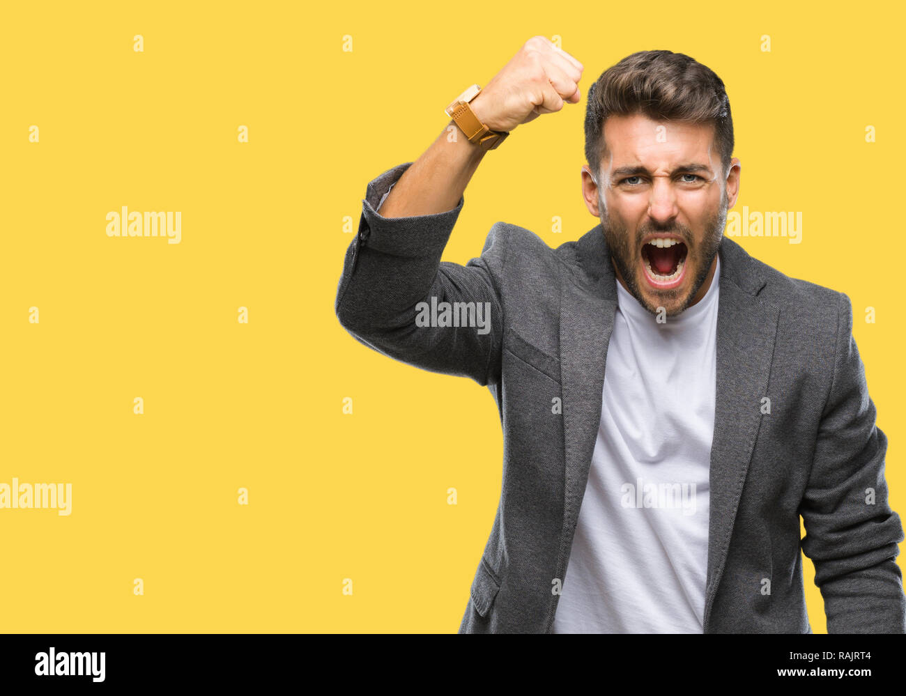 Young handsome business man over isolated background angry and mad ...