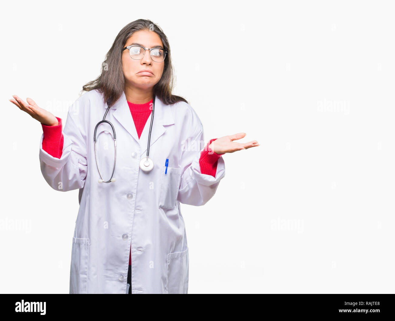 Young arab doctor woman over isolated background clueless and confused ...