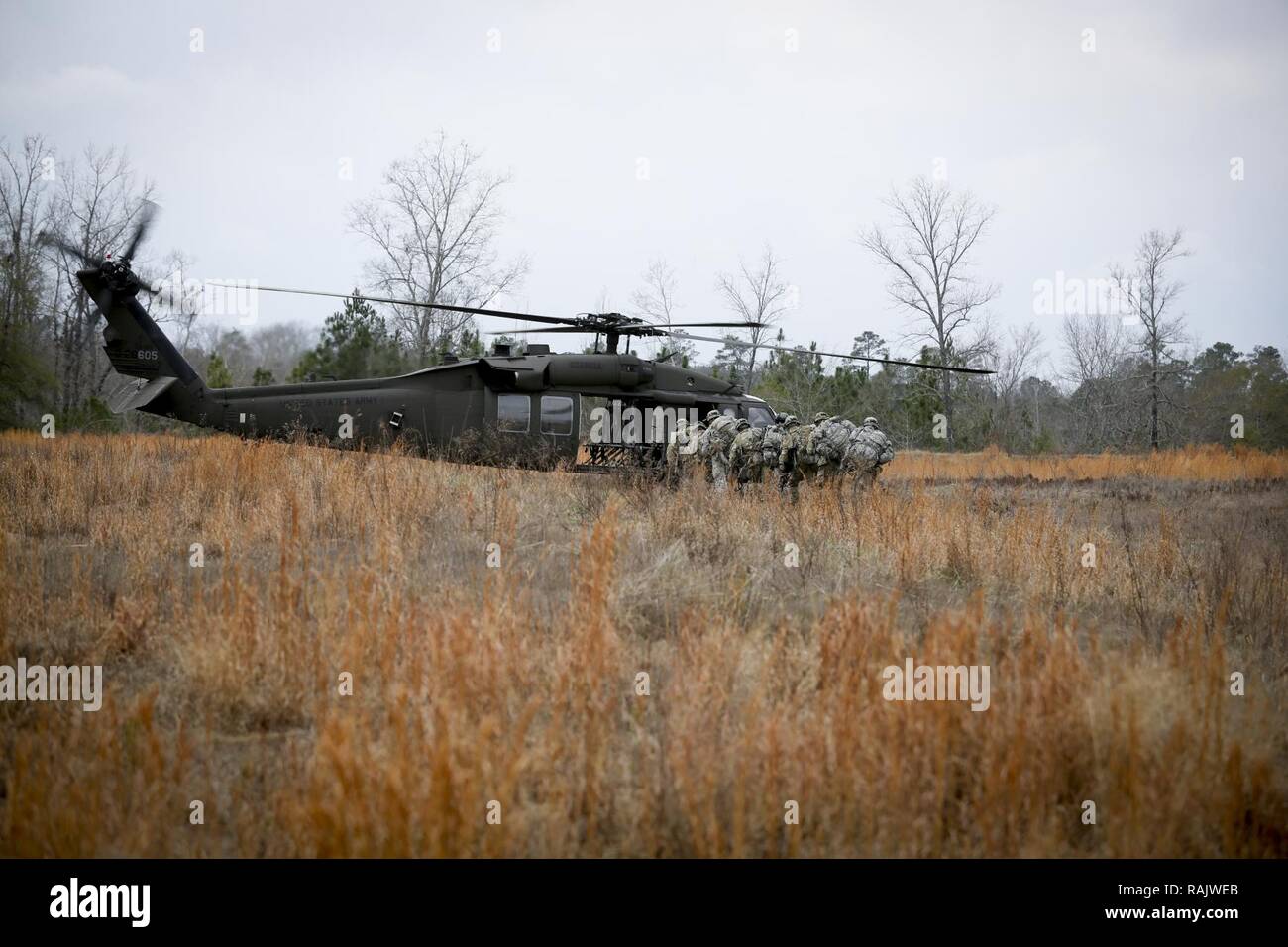 (FORT BENNING, Ga) Soldiers approach and hot load a UH-60 Black Hawk ...