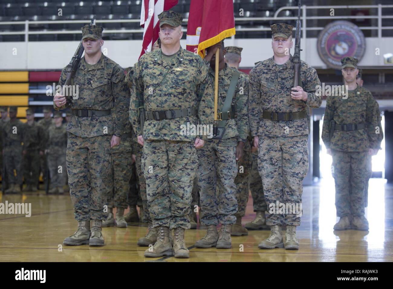 U.S. Marine Corps Lt. Col. John C. Golden, center, off going commanding ...