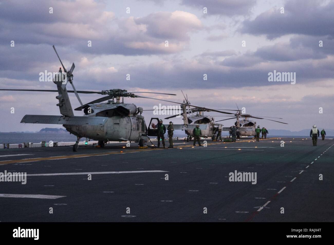 SASEBO, Japan (Feb. 13, 2017) Sailors perform equipment check on MH-60S ...