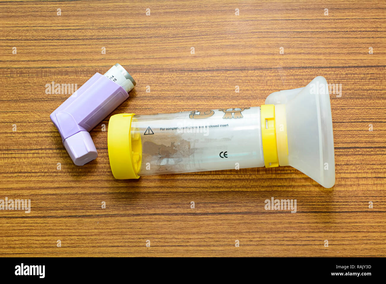 Valved holding chambers on a wood background Stock Photo - Alamy