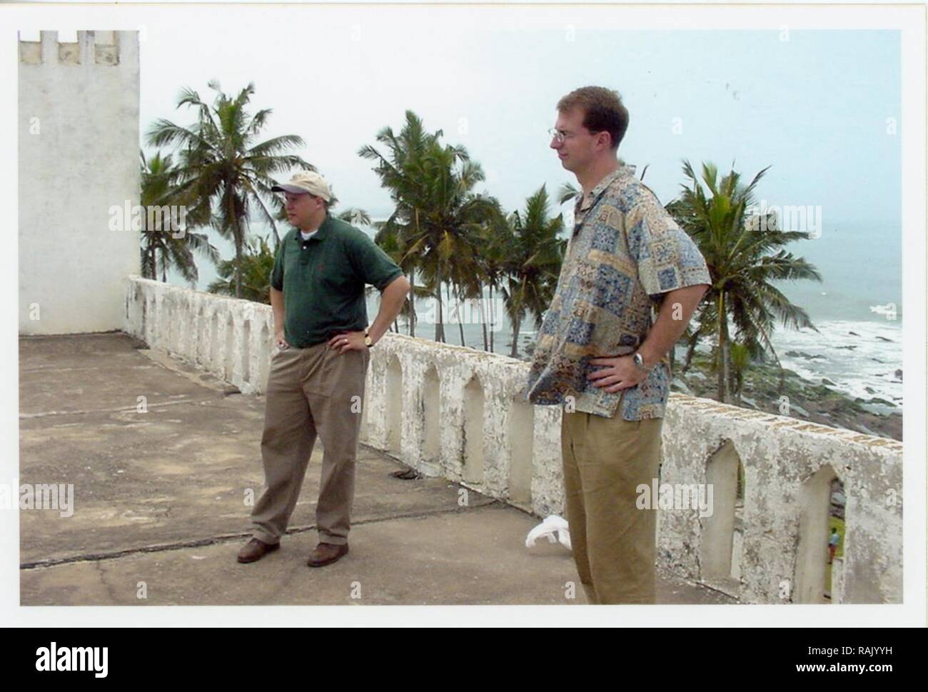 TWO MEN STANDING TALKING TO OTHER MEN Stock Photo - Alamy