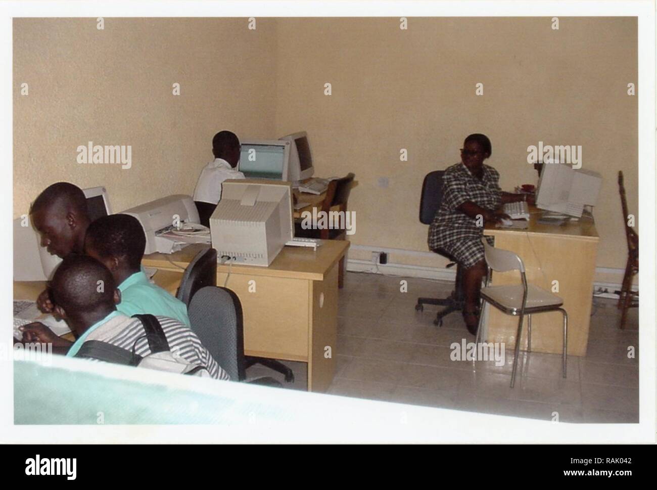 A GROUP OF BOYS AND WOMEN ON THE COMPUTERS Stock Photo - Alamy