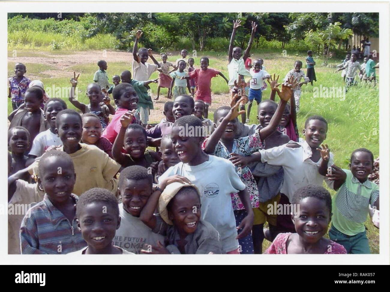 A GROUP OF KIDS PLAYING IN THE FIELDS Stock Photo - Alamy