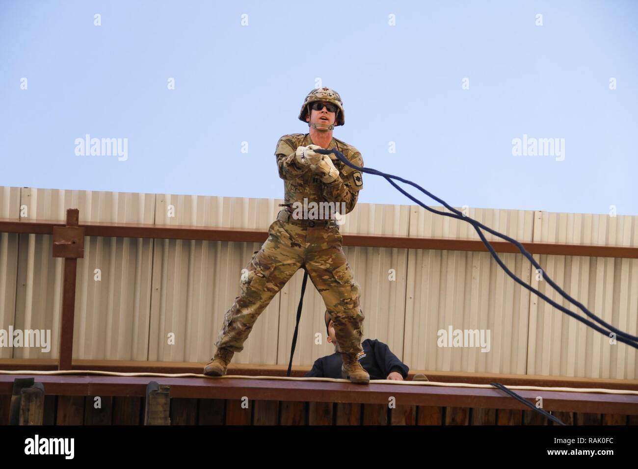 U.S. Army Capt. Brad Barron leans off the tower to rappel Aussie style ...