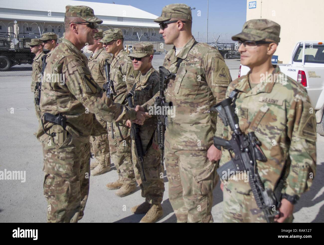 Maj. Gen. John C. Thomson III gives coins to Soldiers from Charlie ...