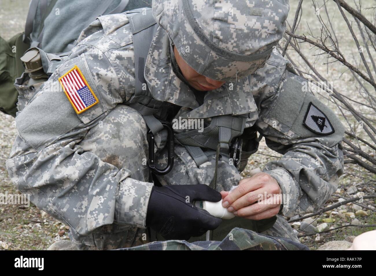 U.S. Army Sgt. Kinoroy Quilaton of the 91st Training Division provides ...