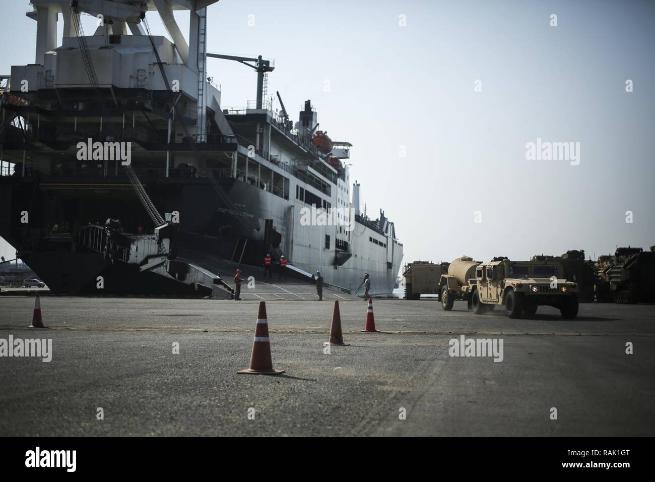 A U.S. Marine with Combat Logistics Battalion 4, drive a High Mobility ...