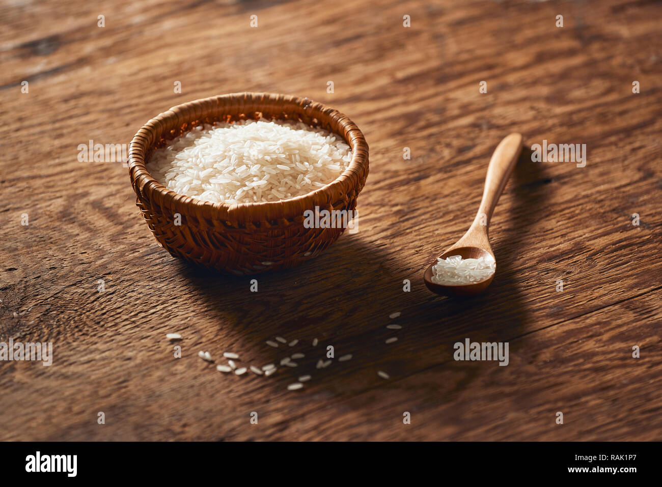 Jasmine rice isolated on texture background Stock Photo - Alamy