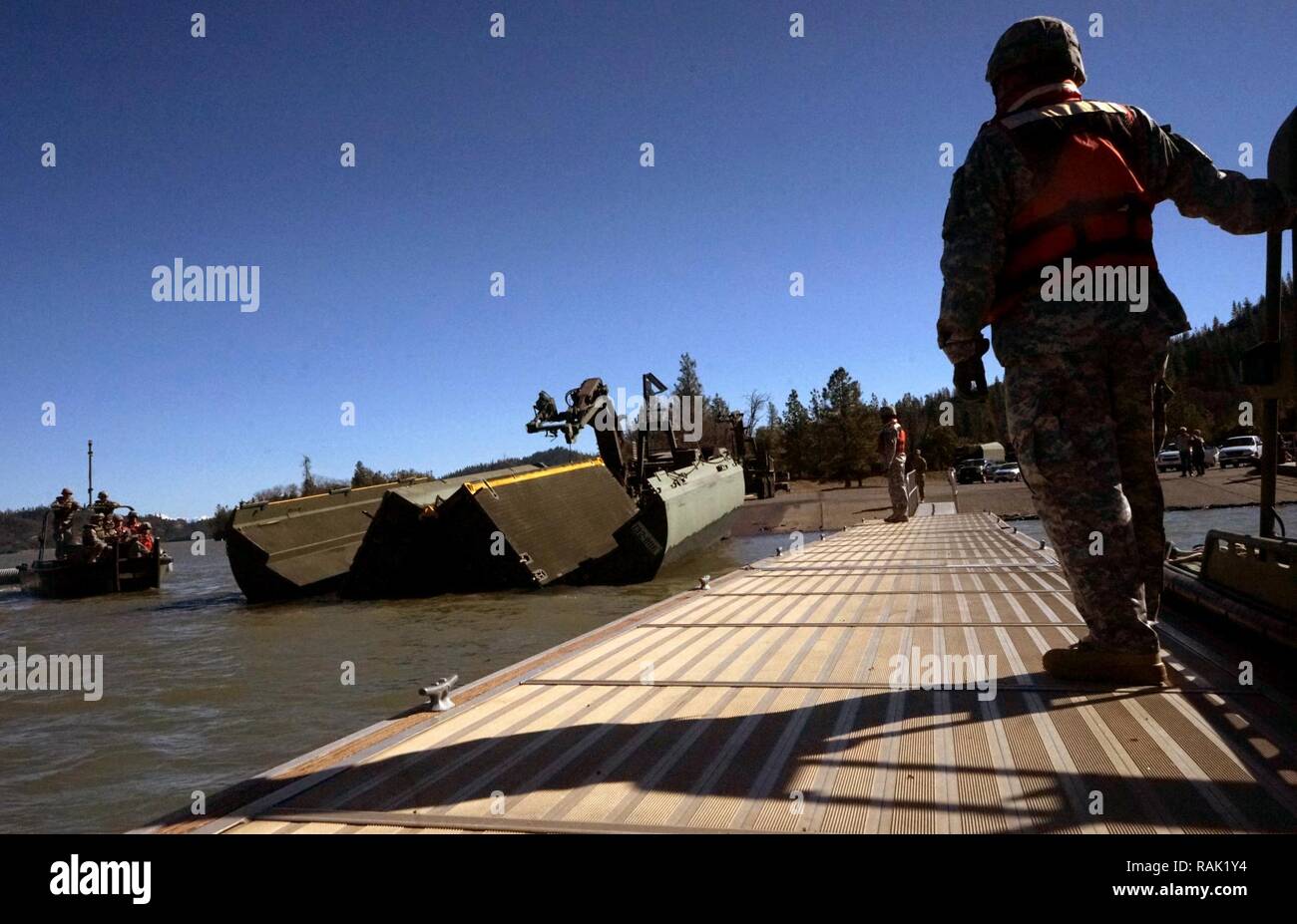 Crewmembers from the 132nd Multi-Role Bridge Company oversee the ...
