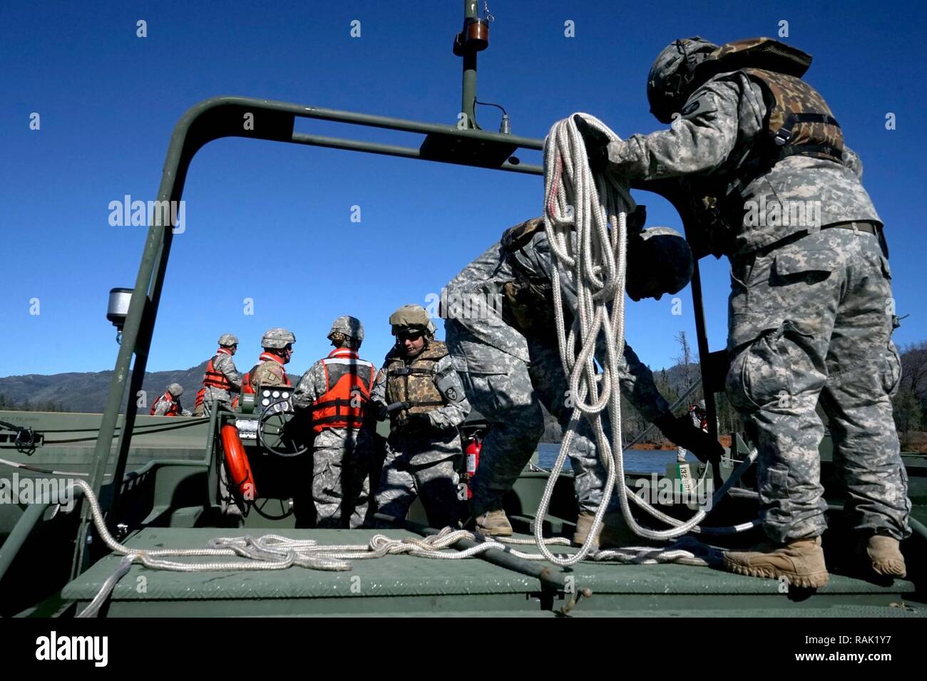 Crewmembers from the 132nd Multi-Role Bridge Company work together to ...
