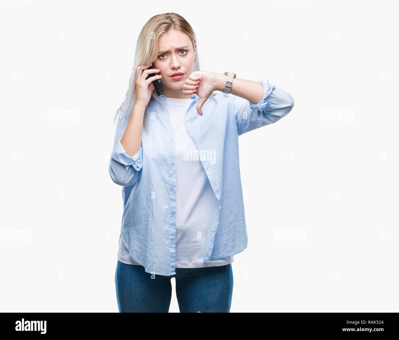 Young blonde woman talking using smarpthone over isolated background ...