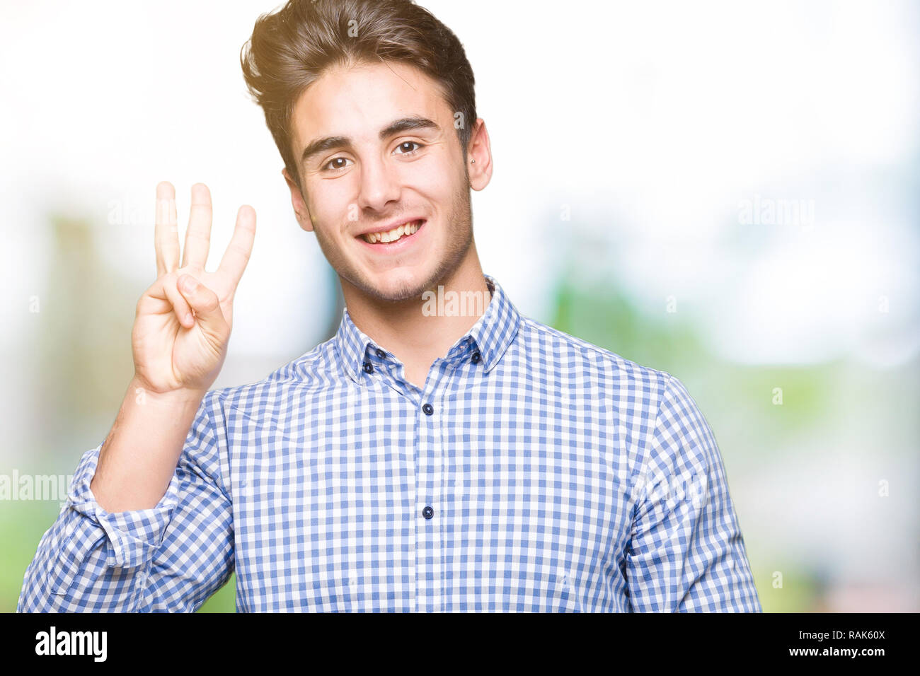 Young handsome business man over isolated background showing and ...