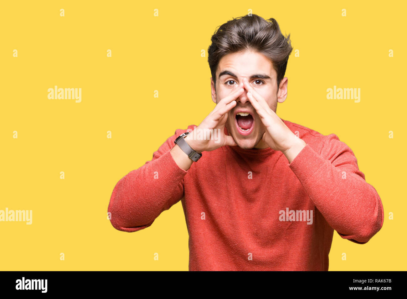 Young handsome man over isolated background Shouting angry out loud ...