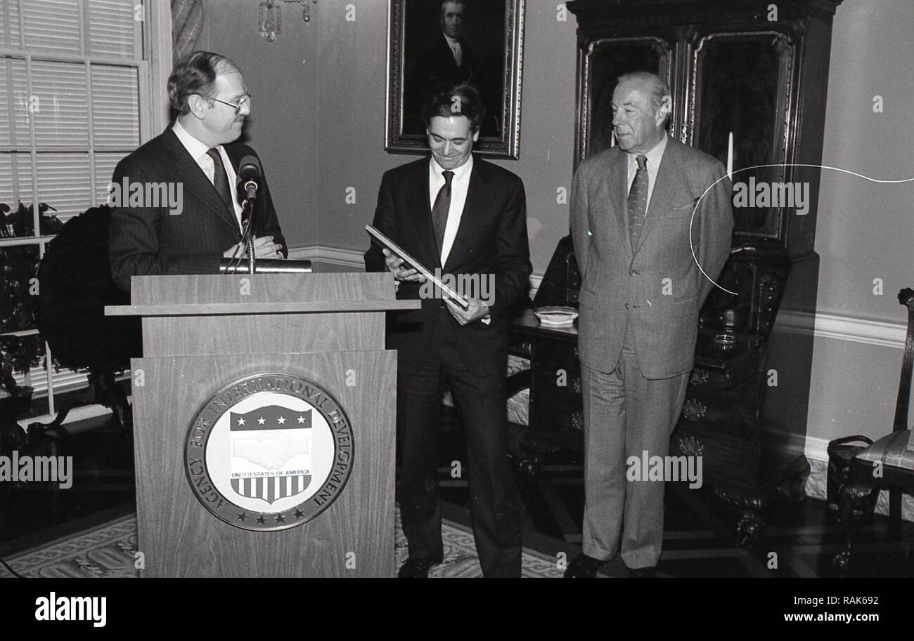 THREE MEN AT THE PODIUM WITH ONE MAN HOLDING HIS AWARD Stock Photo - Alamy