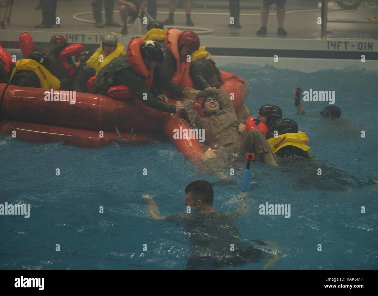 NASA astronauts and Survival School students help pull survivors into a ...