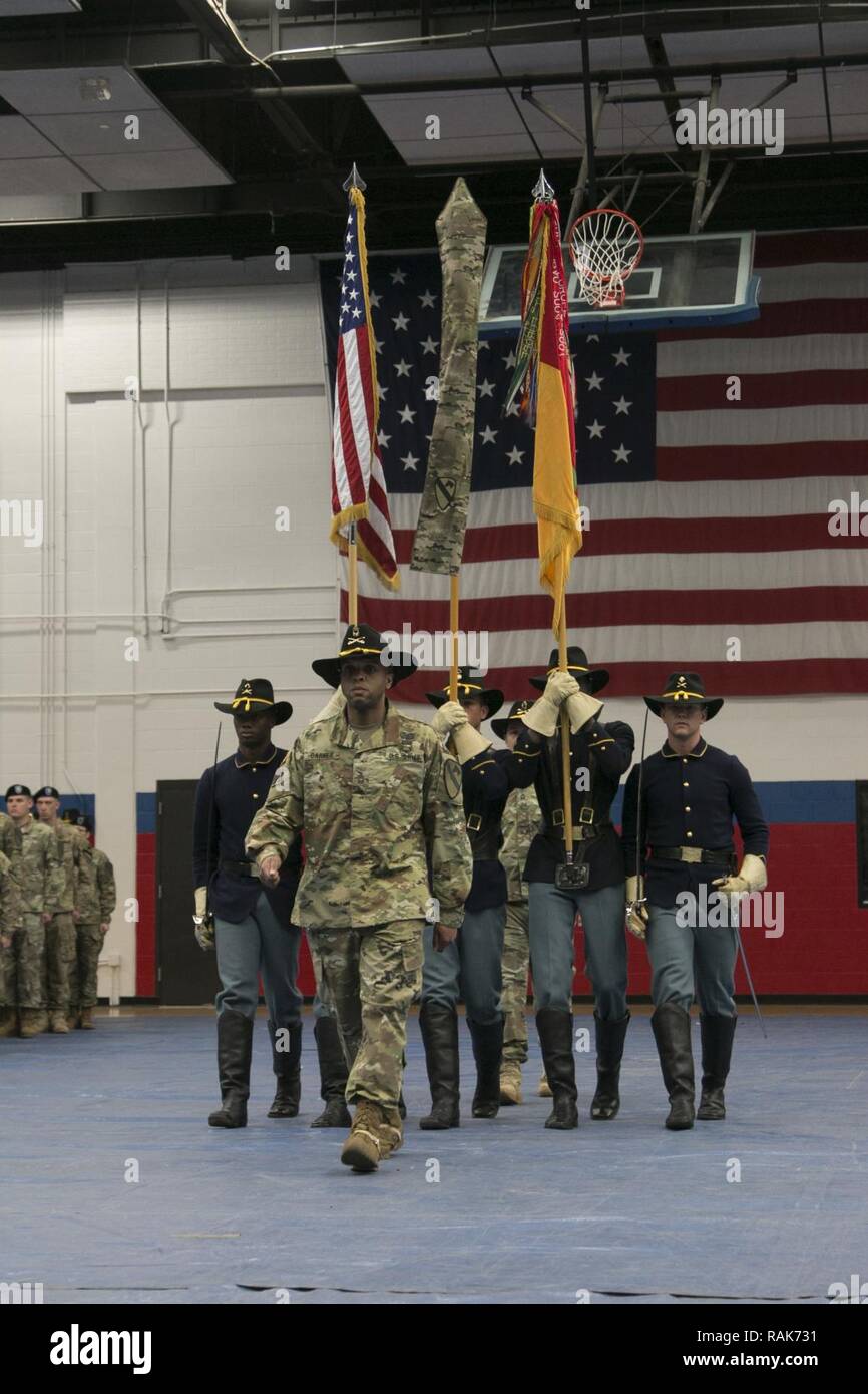 Master Sgt. Troy Garner, the commander of troops, marches ahead of the ...
