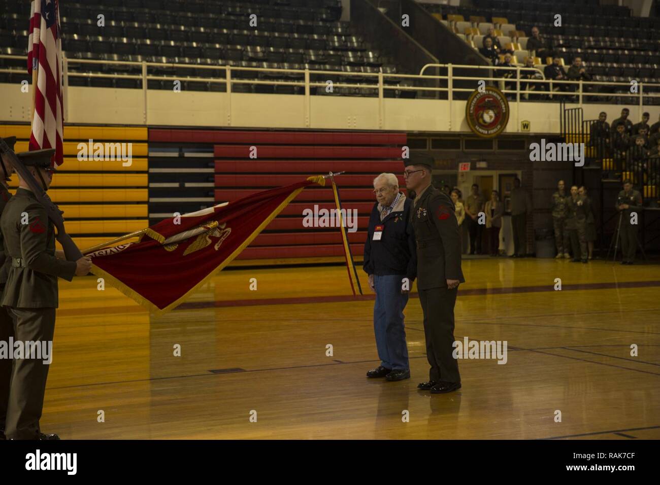Marine veteran Jim Mahoney gives a Marine the Presidential Unit ...