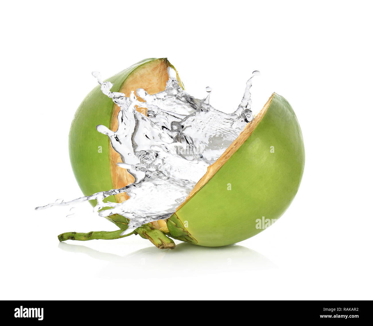 Green coconut with water splash isolated on white background Stock ...