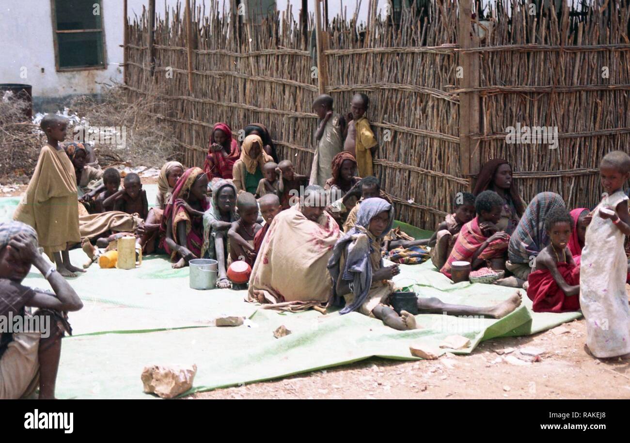 MEN WOMEN AND CHILDREN GATHERED IN AREA Stock Photo - Alamy