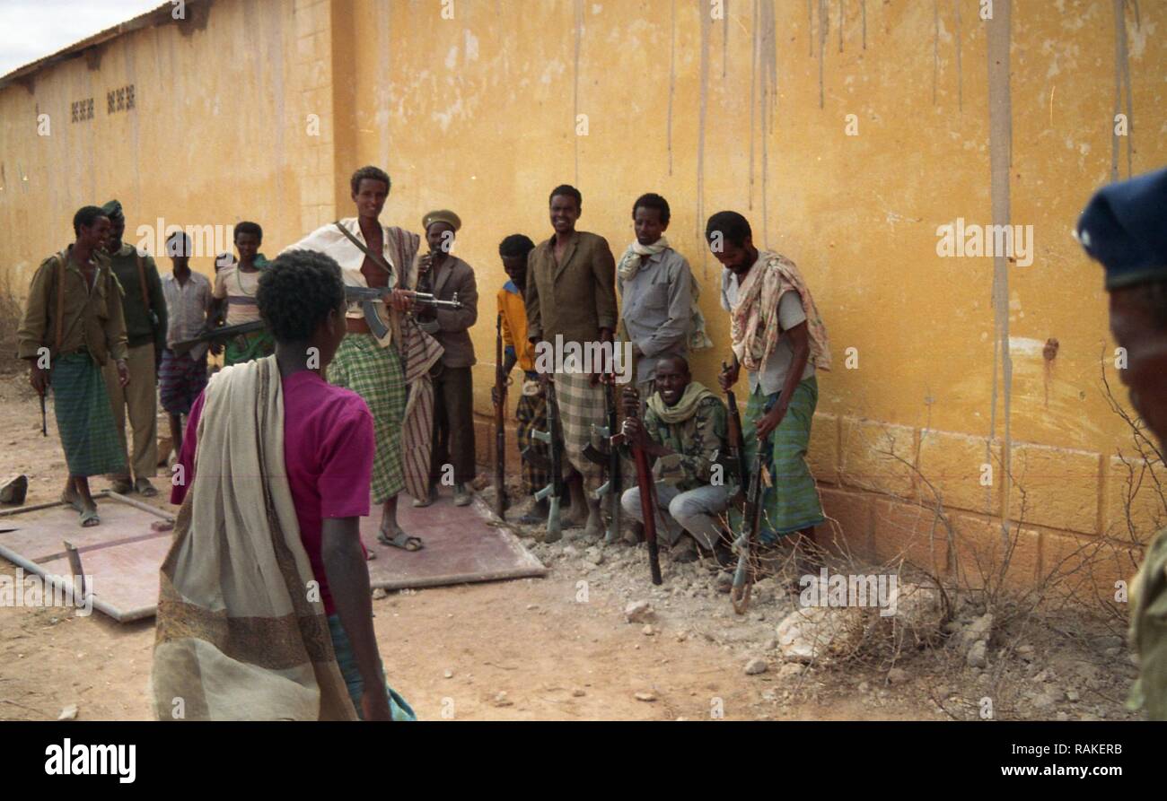 MEN STANDING IN LINE WITH GUNS Stock Photo - Alamy