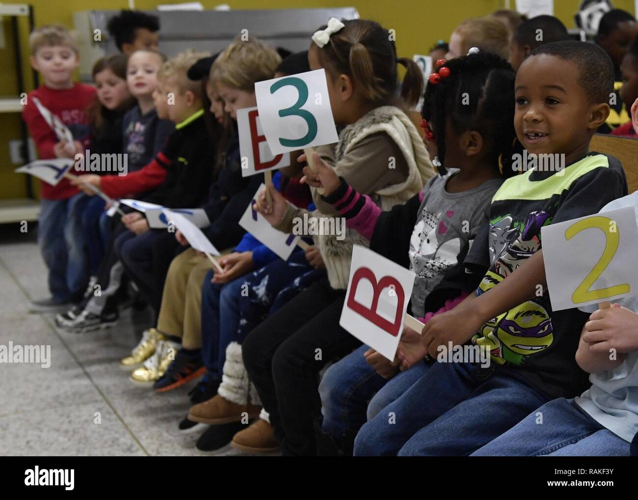 Students from Marrington Elementary School hold up signs to answer ...
