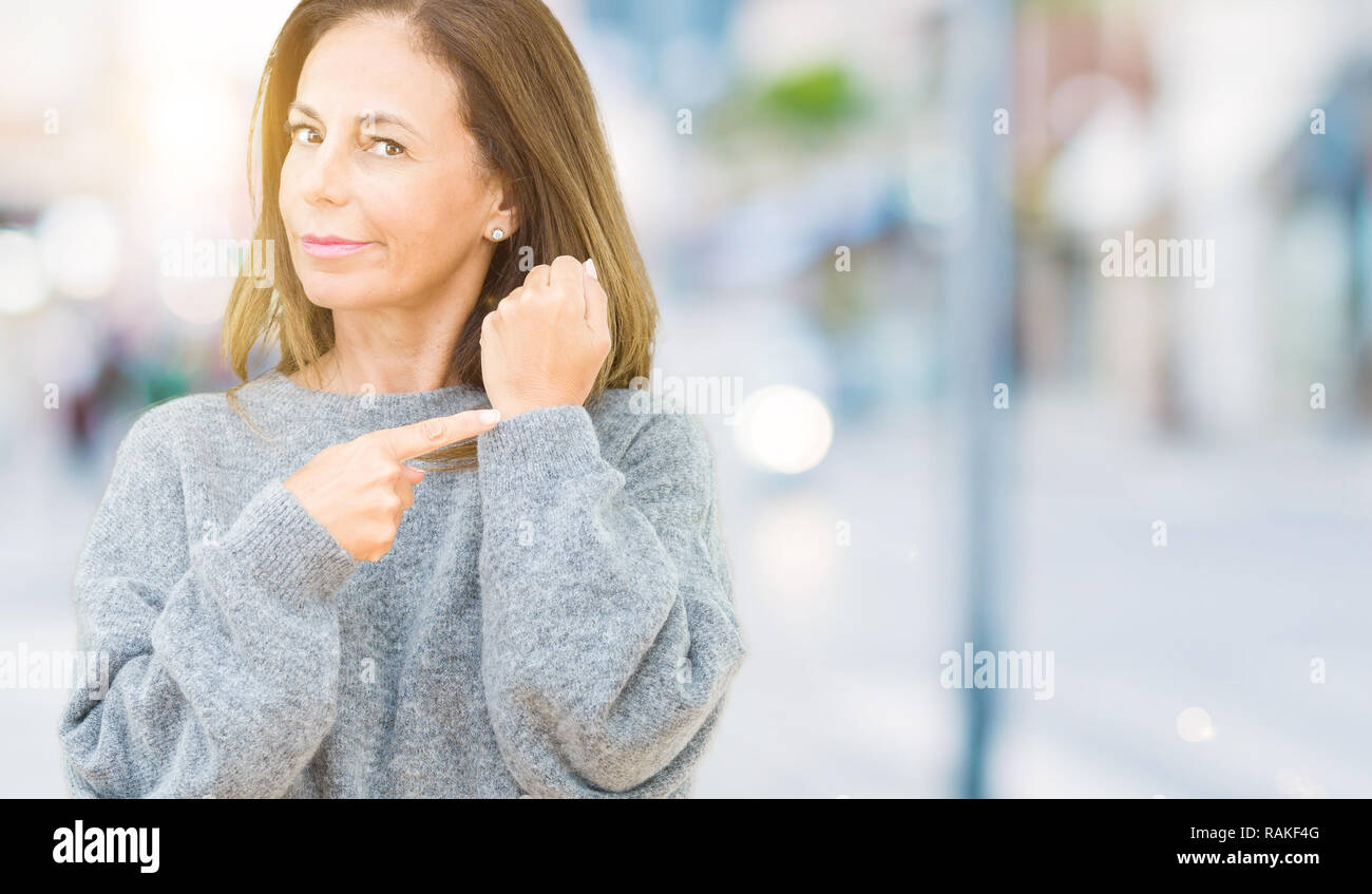 Beautiful middle age woman wearing winter sweater over isolated ...