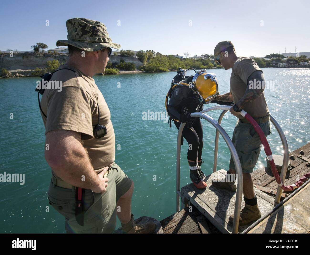 Chief Builder Matthew Meade, left, assigned to Underwater Construction ...