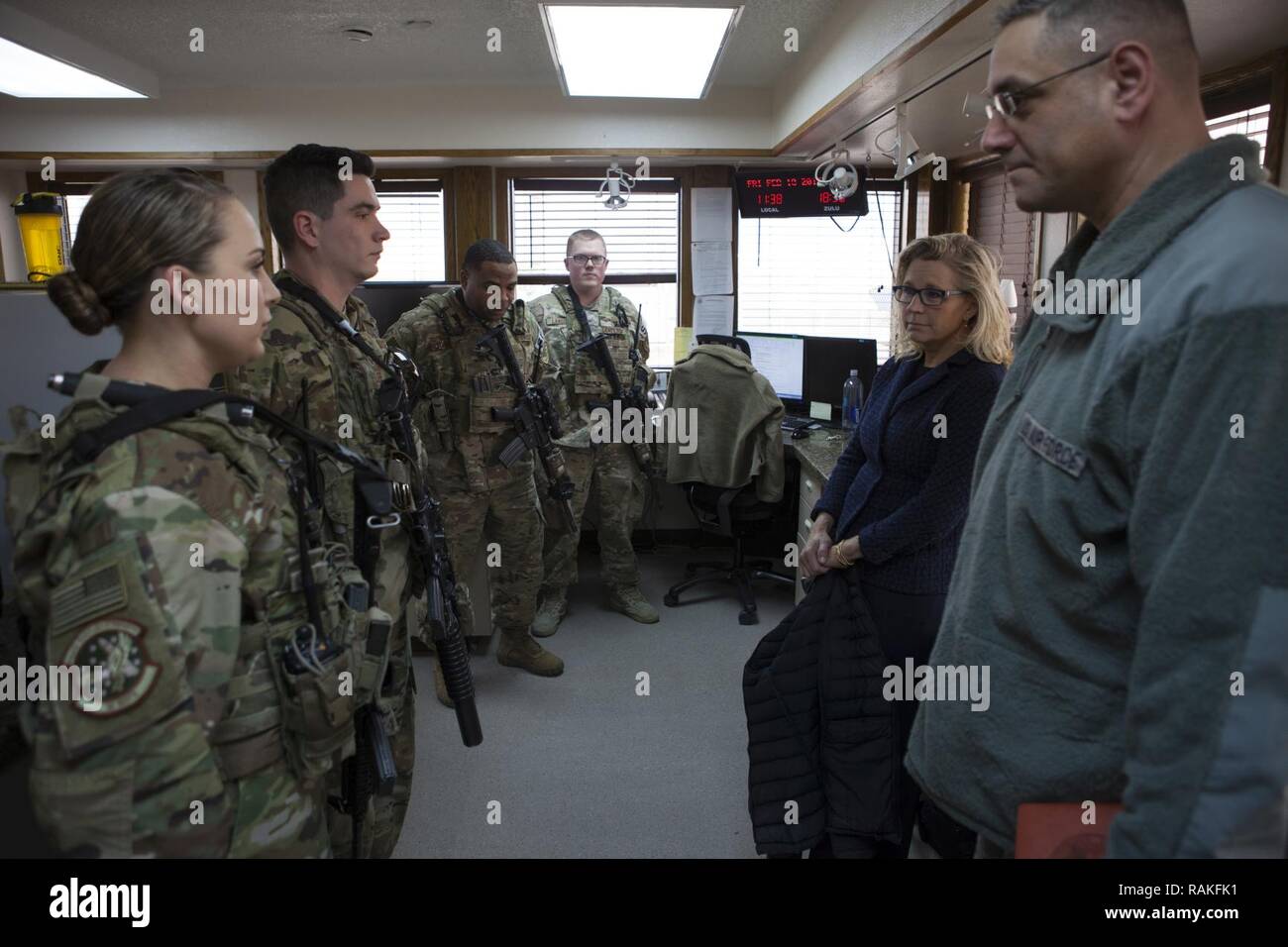 A 90th Missile Security Forces Squadron defender briefs U.S. Rep. Liz ...