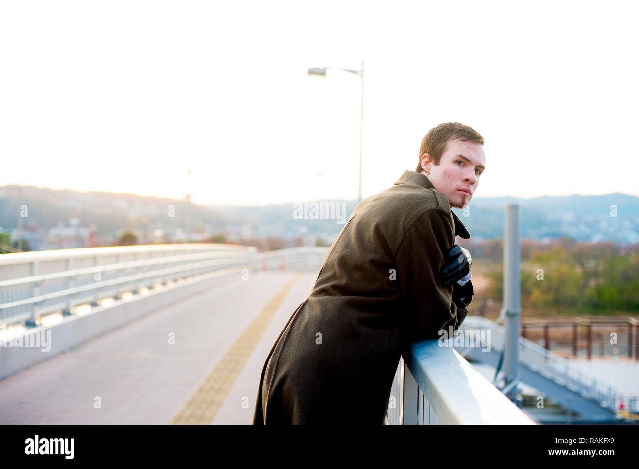 Caucasian male model poses for pictures on the street Stock Photo - Alamy