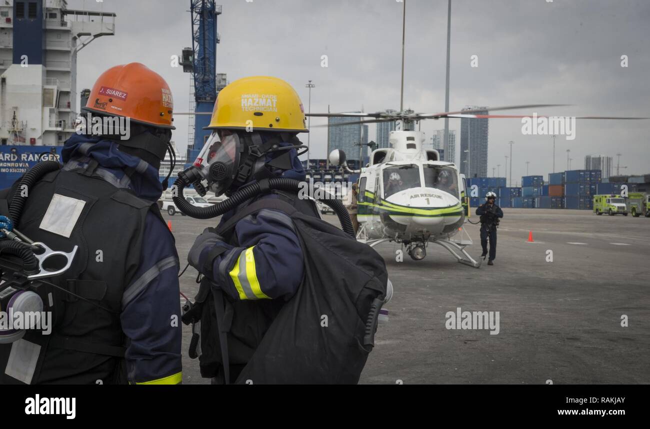 Miami-Dade Fire Rescue emergency responders prepare to board an air ...