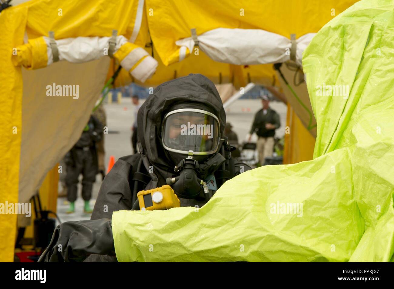 An Army Reserve Soldier uses a multiple gas monitor on a Soldier who ...