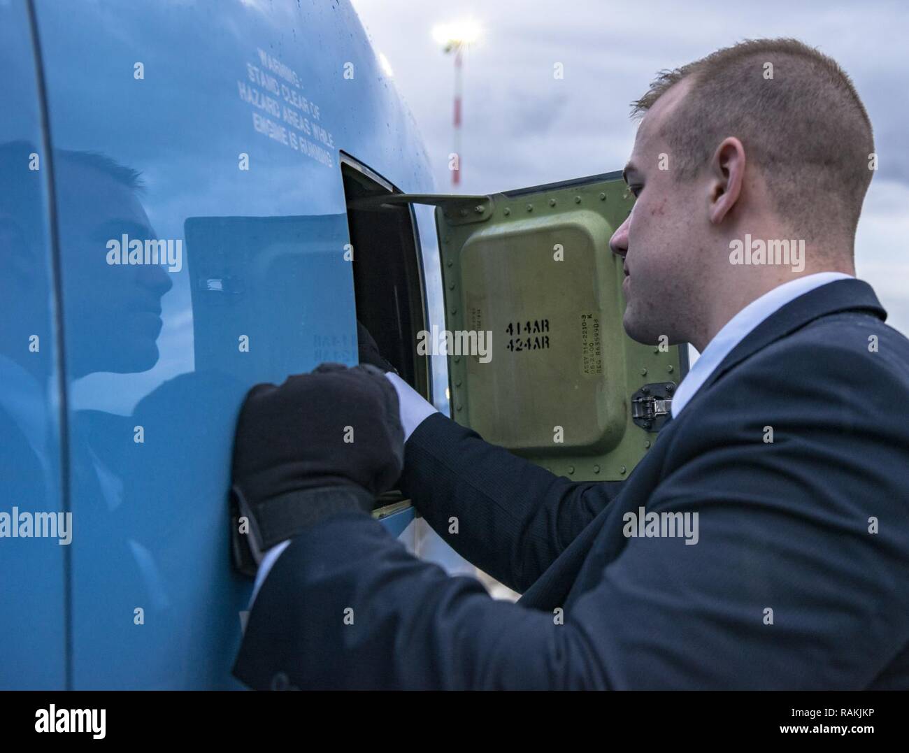 Staff Sgt. Jacob Curtis, 89th Maintenance Group flying crew chief, tops ...