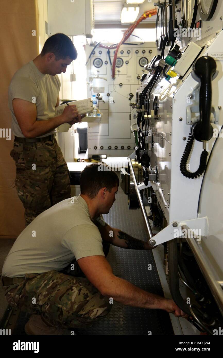 Salvage diver Spc. Nathaniel Marquez (back) and Sgt. Christopher Miller ...