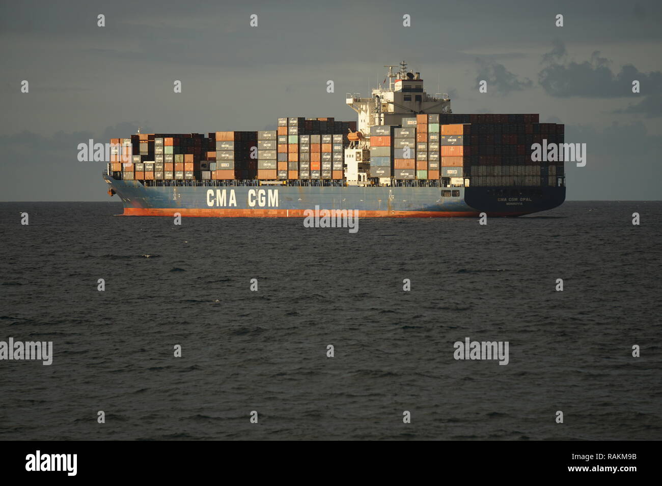 A huge tanker with a full load of containers on the indian ocean at ...
