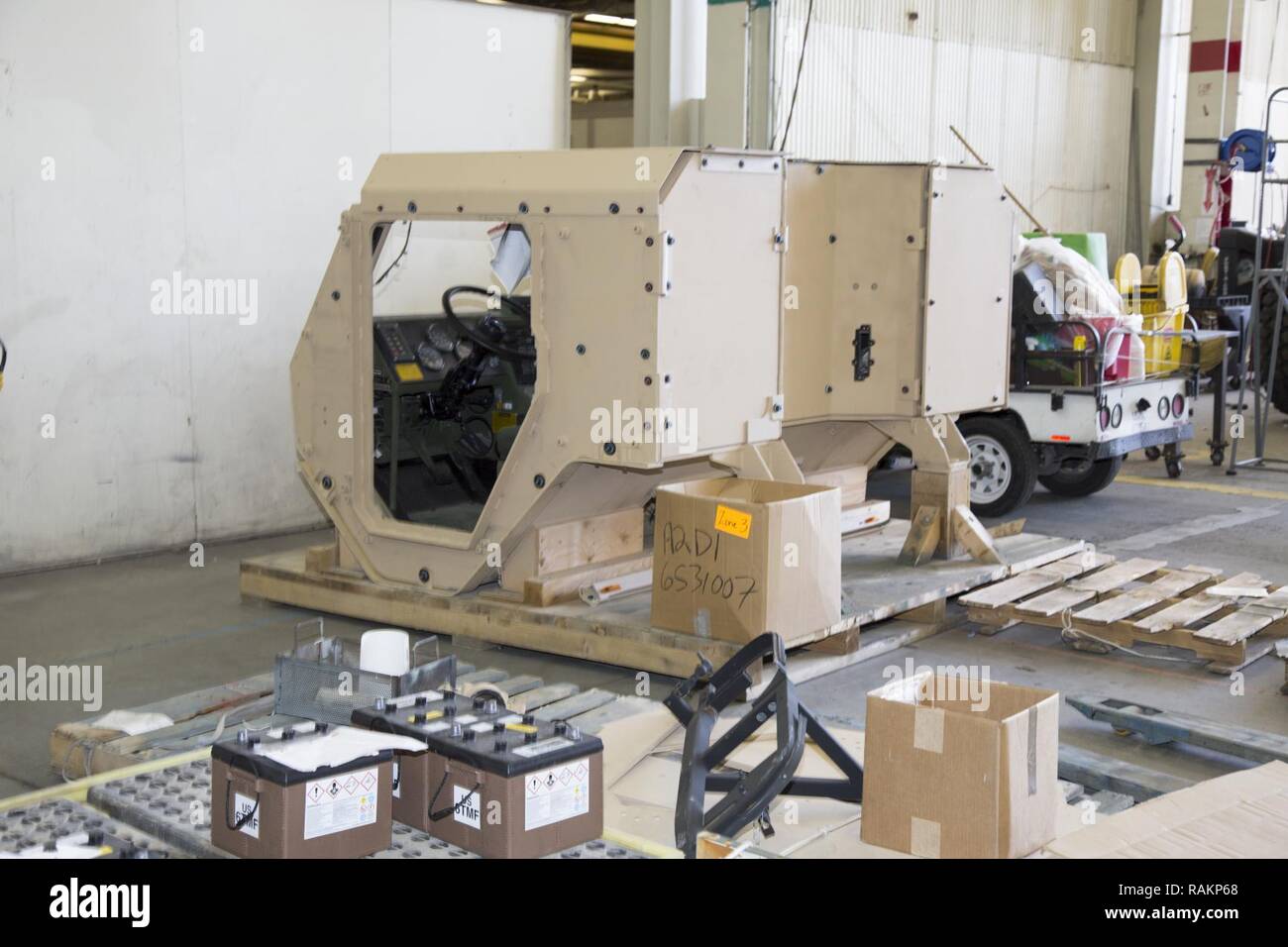A heavily armored crew capsule of an LVSR AMKR vehicle on the floor of ...
