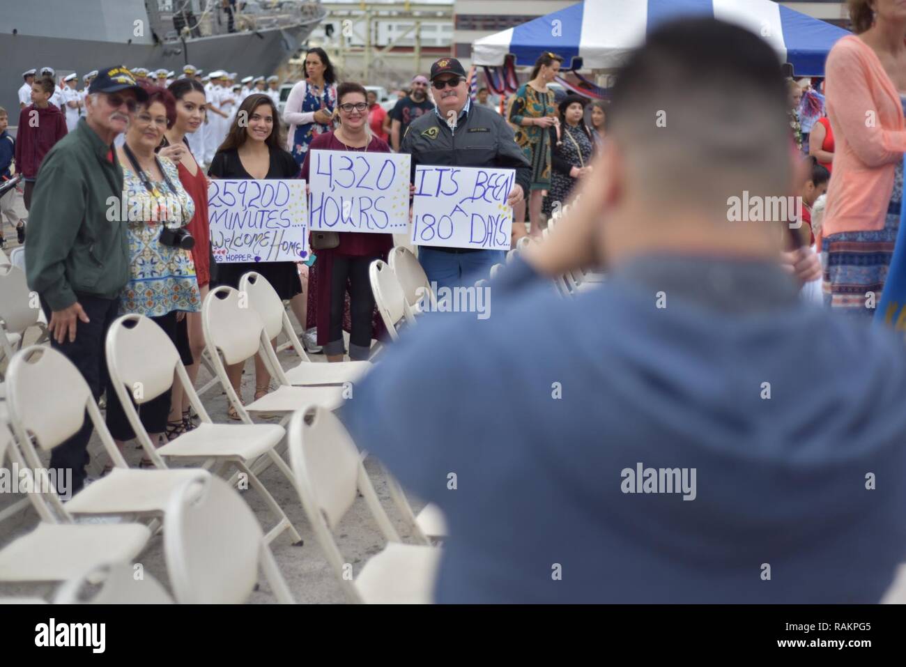 A family waits for their loved one to arrive home from his 180-day ...