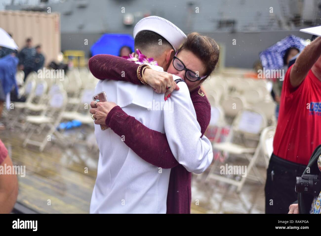 A mother embraces her son after his return from his 180-day deployment ...