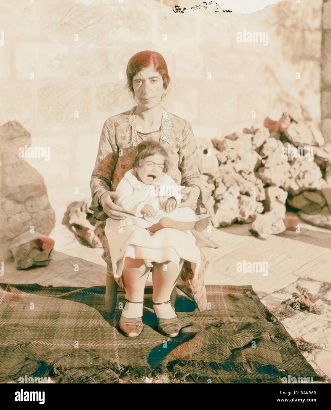 Anna Spafford baby home in Jerusalem. a woman with a child on her lap ...