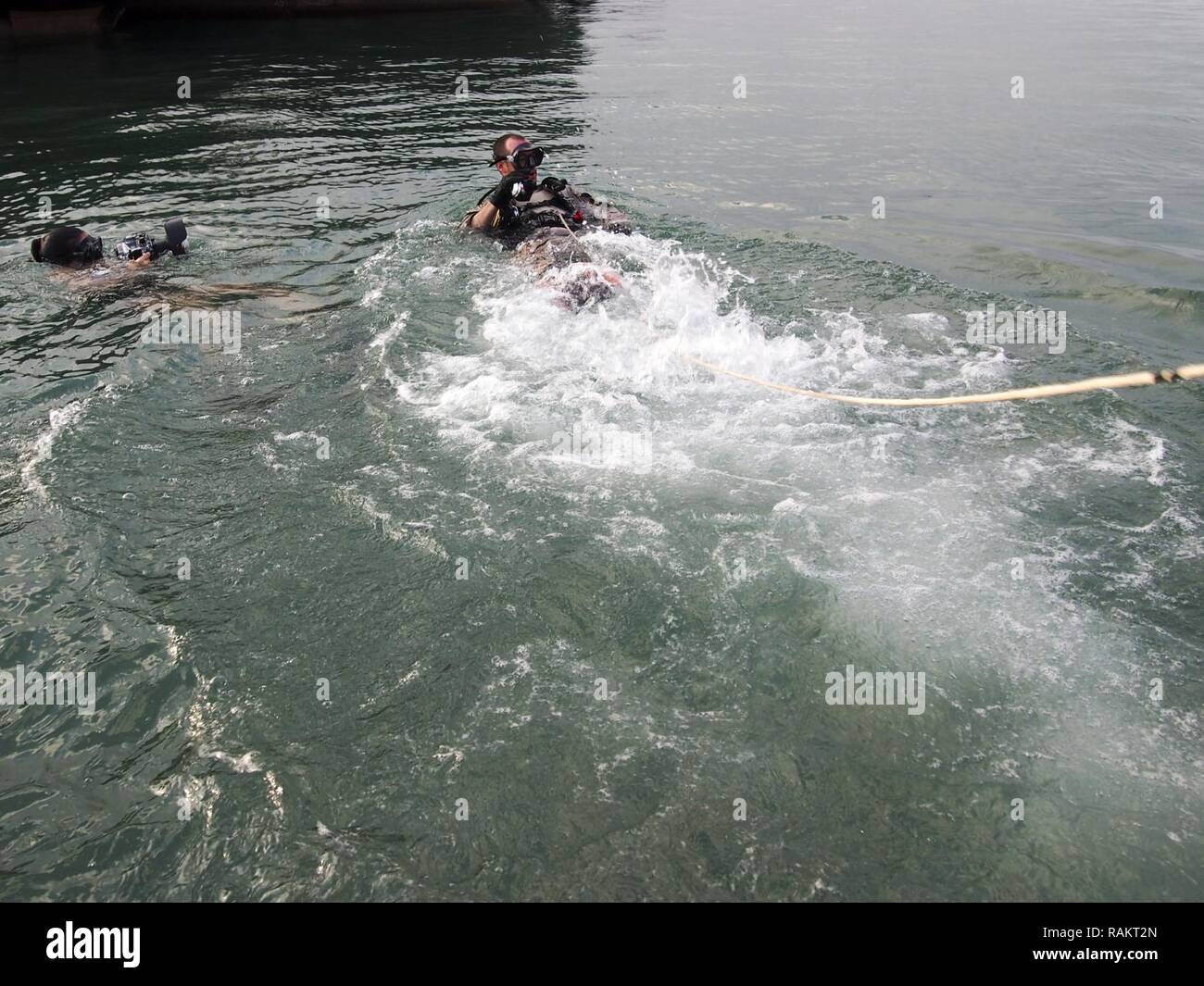 U.S. Navy Explosive Ordinance Disposal Mobility Unit (EODMU) personnel ...