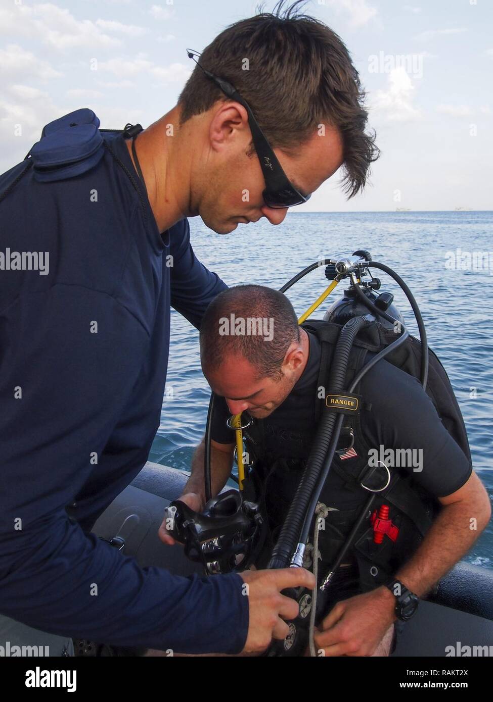 U.S. Navy Explosive Ordinance Disposal Mobility Unit (EODMU) personnel ...