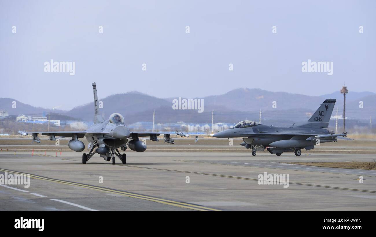 Two F-16 Fighting Falcons assigned to the 119th Fighter Squadron from ...